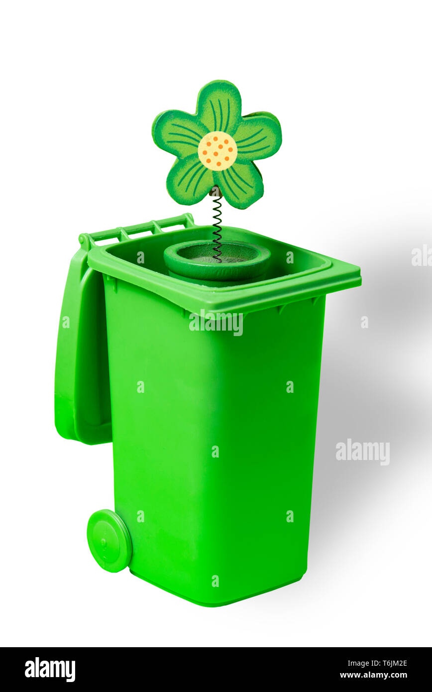 Yellow trash can filled with flowers isolated over white background ...