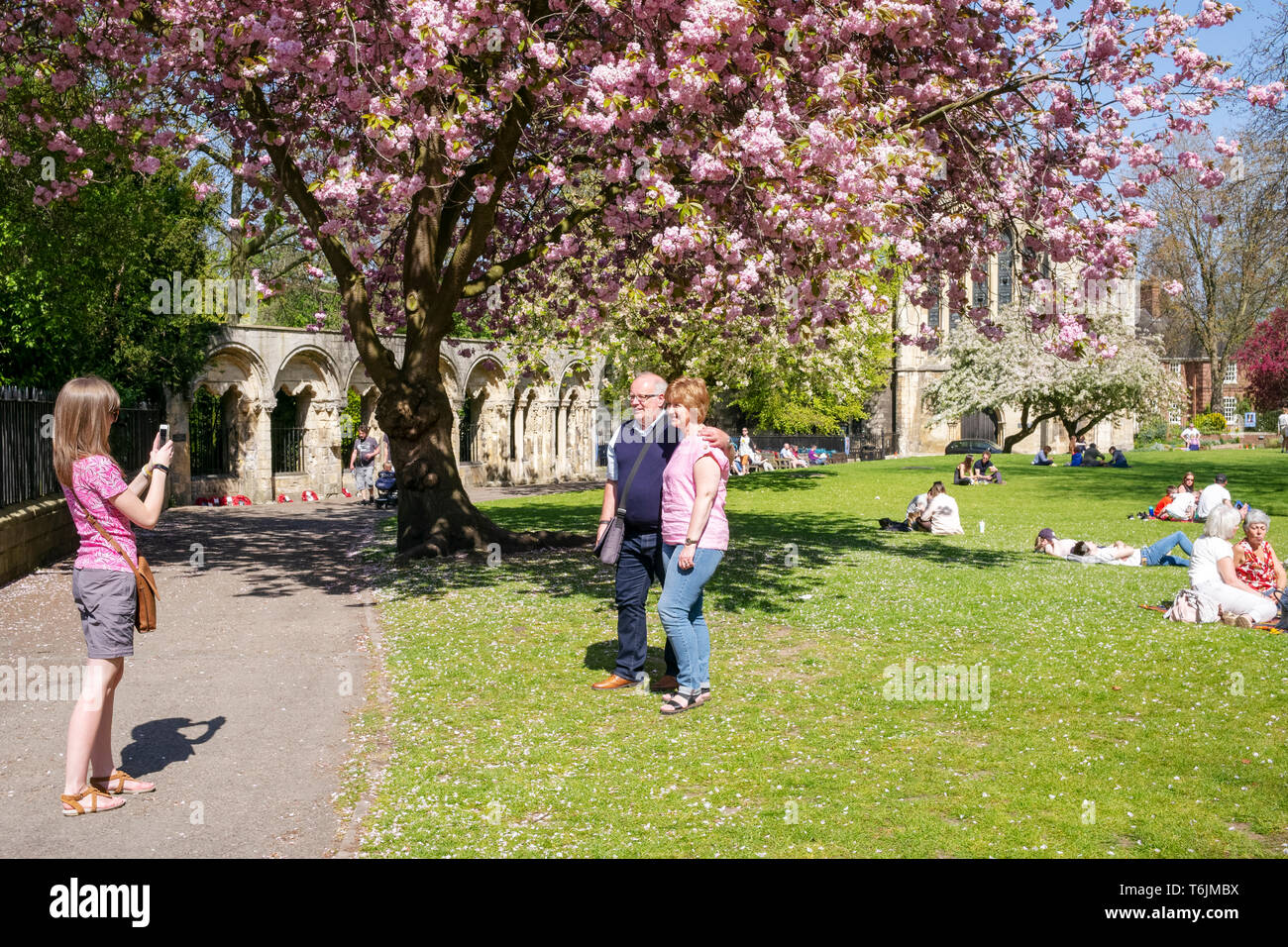 Capturing the moment on a warm Spring day, Dean's Park, York, UK Stock ...