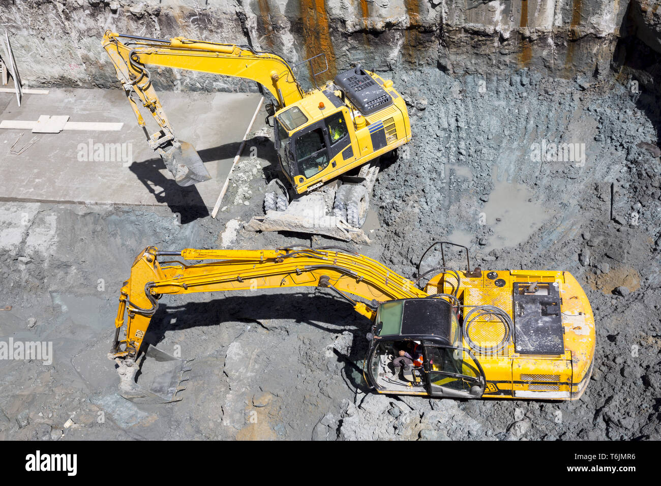 Excavators Baggers digging at a construction site Stock Photo - Alamy