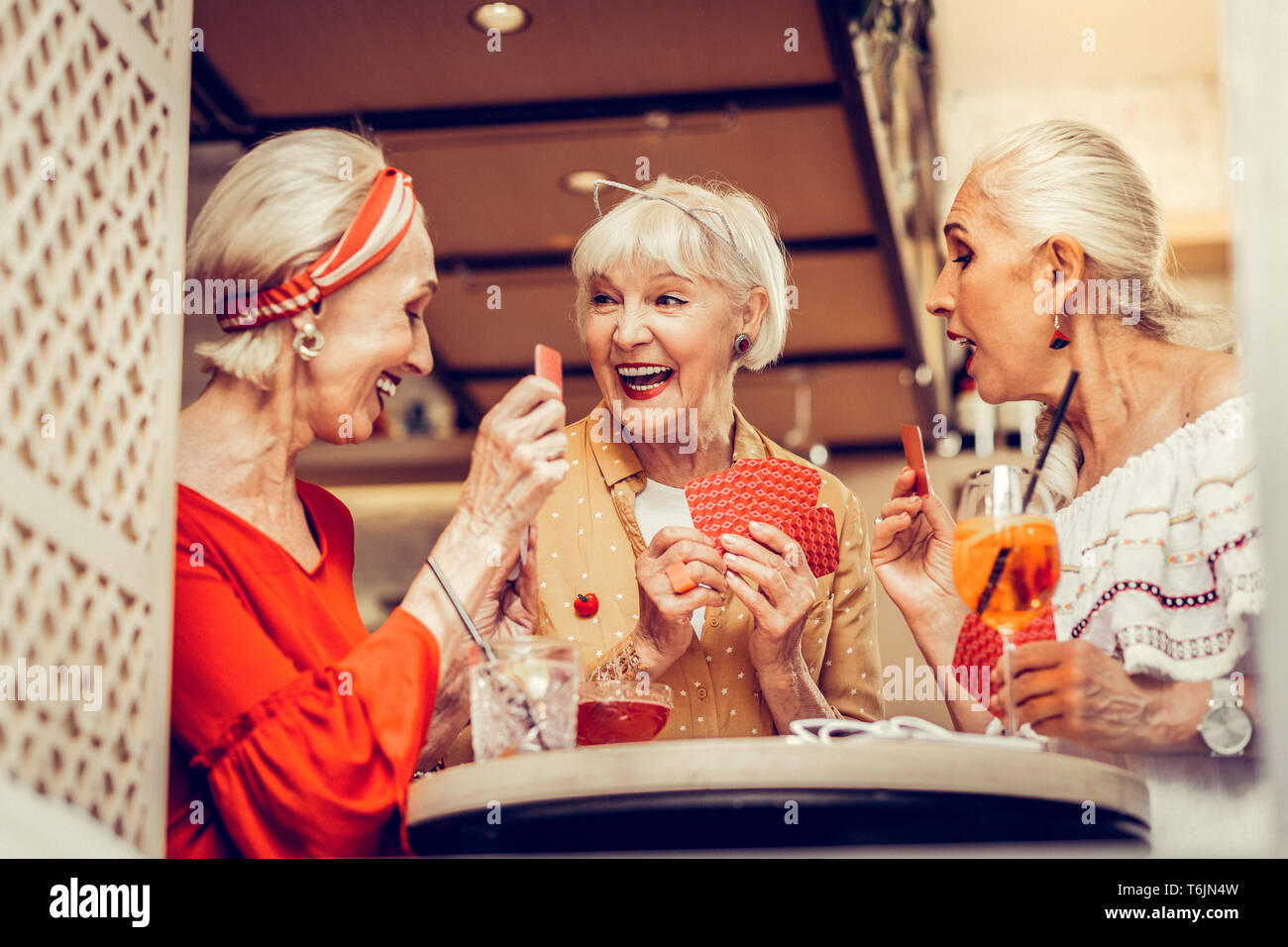 Beautiful young woman playing cards hi-res stock photography and images ...