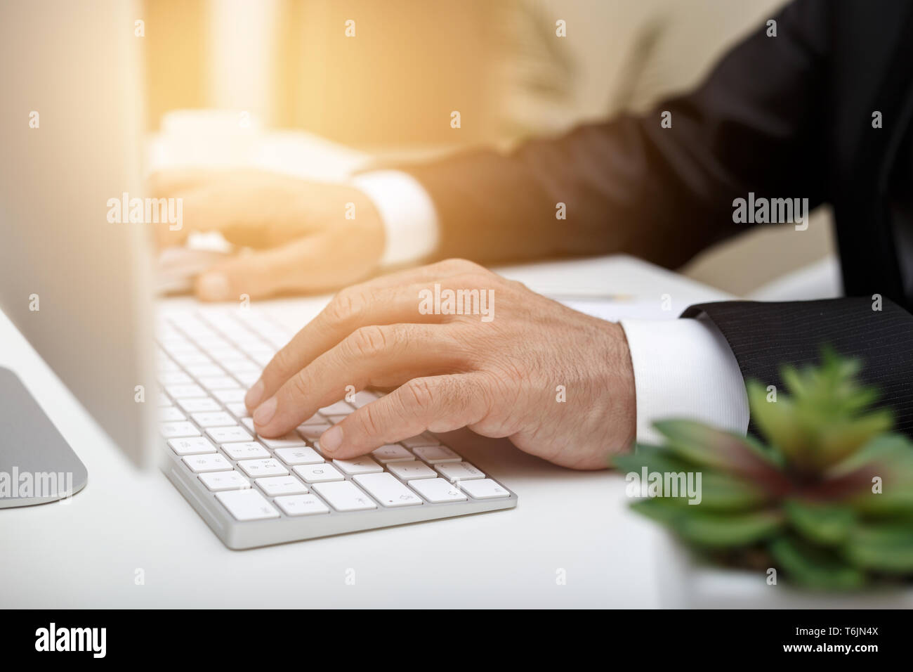 Male businessman typing hi-res stock photography and images - Alamy