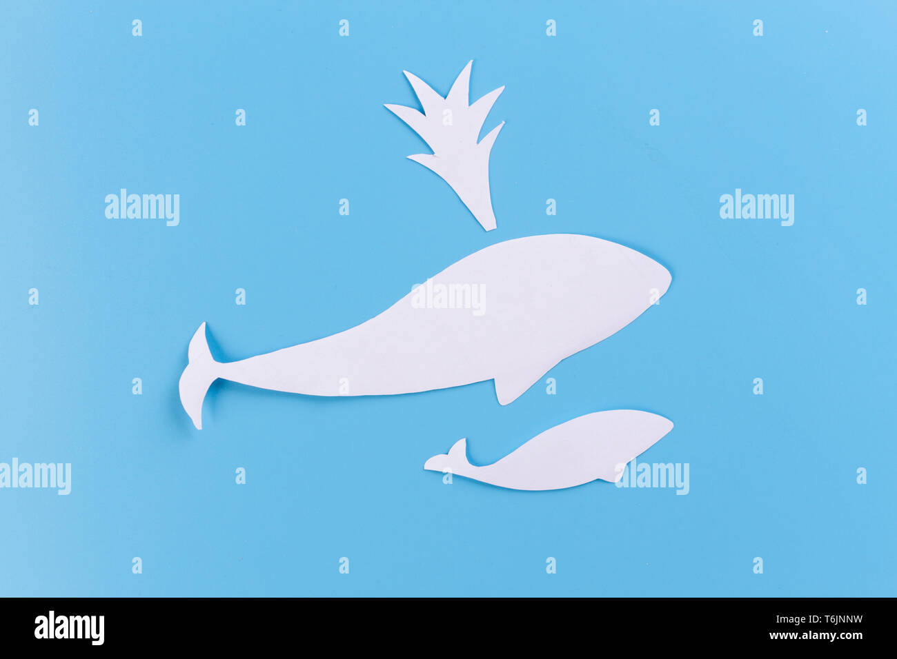 whale made of paper on blue background Stock Photo - Alamy