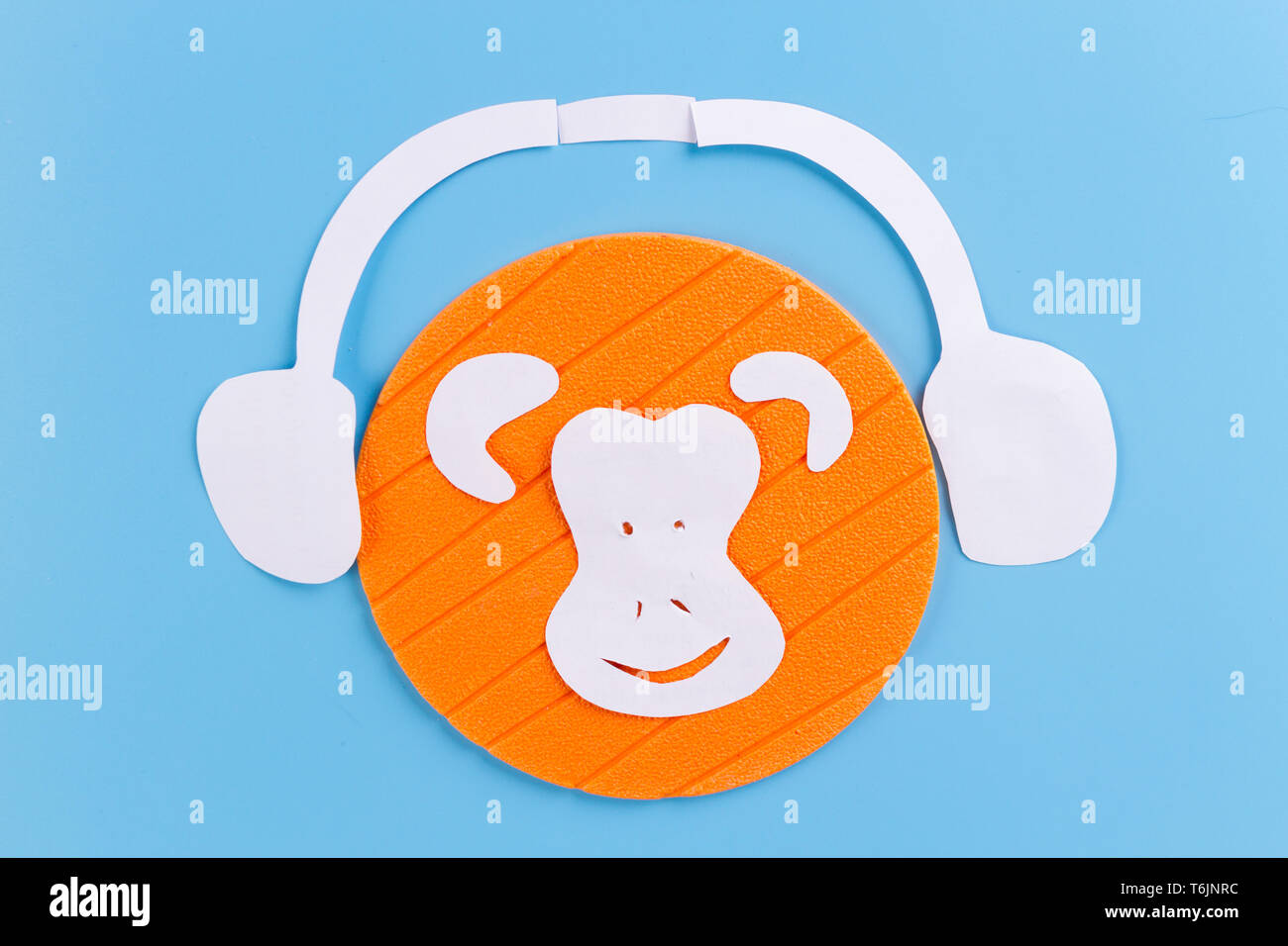 funny monkey made of paper in headphones Stock Photo - Alamy