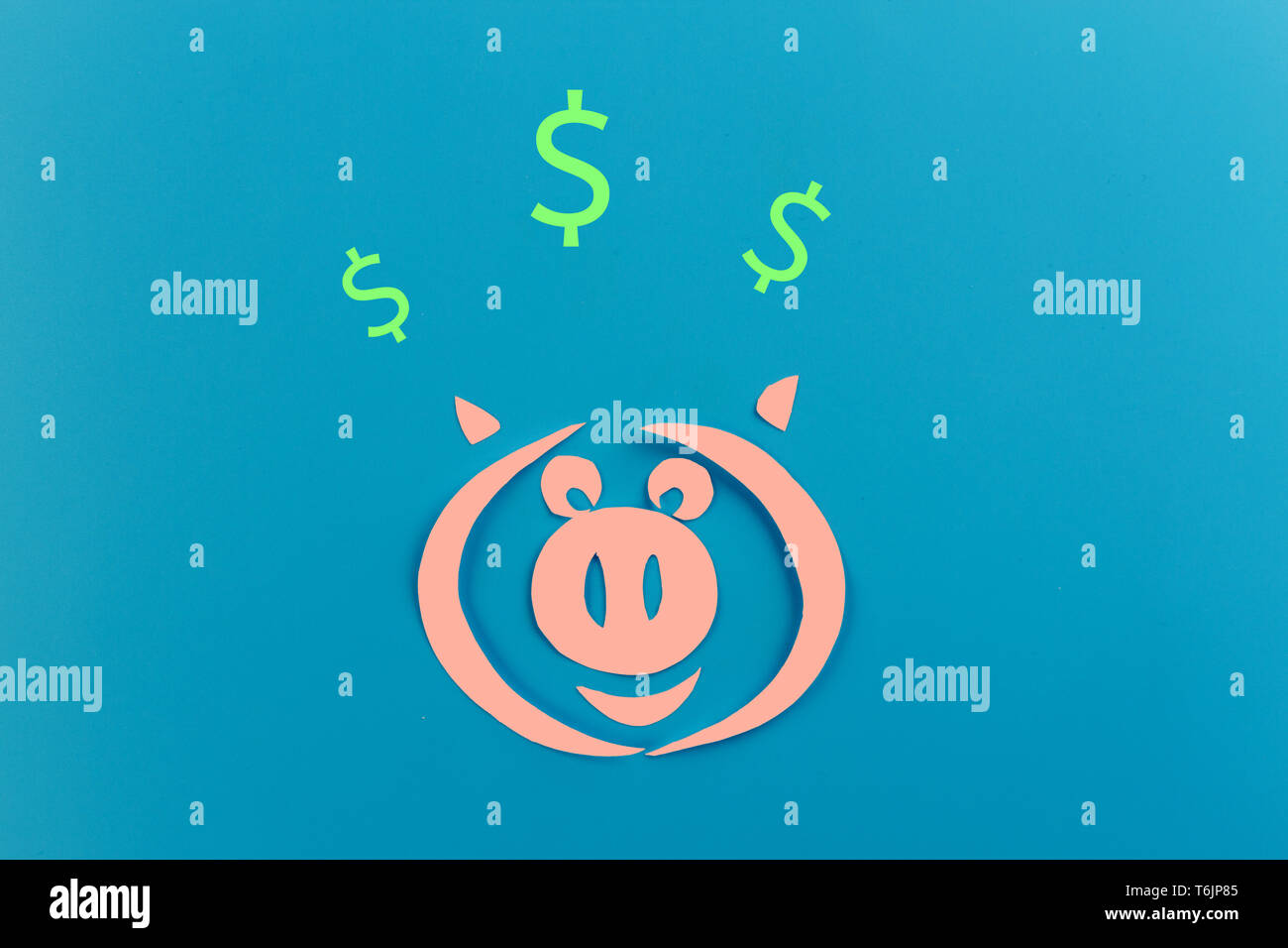 pig on the blue background with money Stock Photo - Alamy
