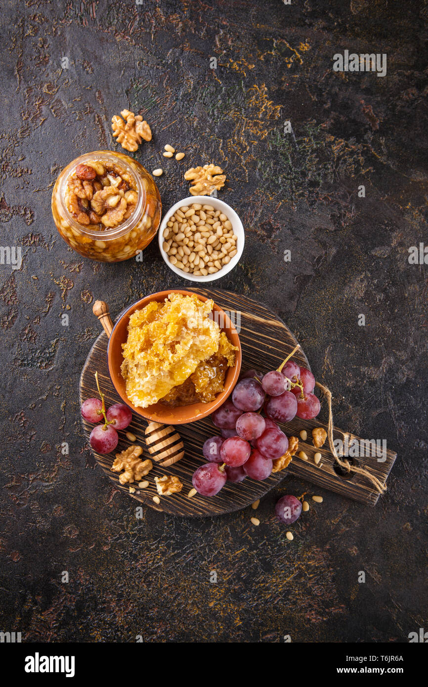 Honey, grapes and nuts Stock Photo - Alamy