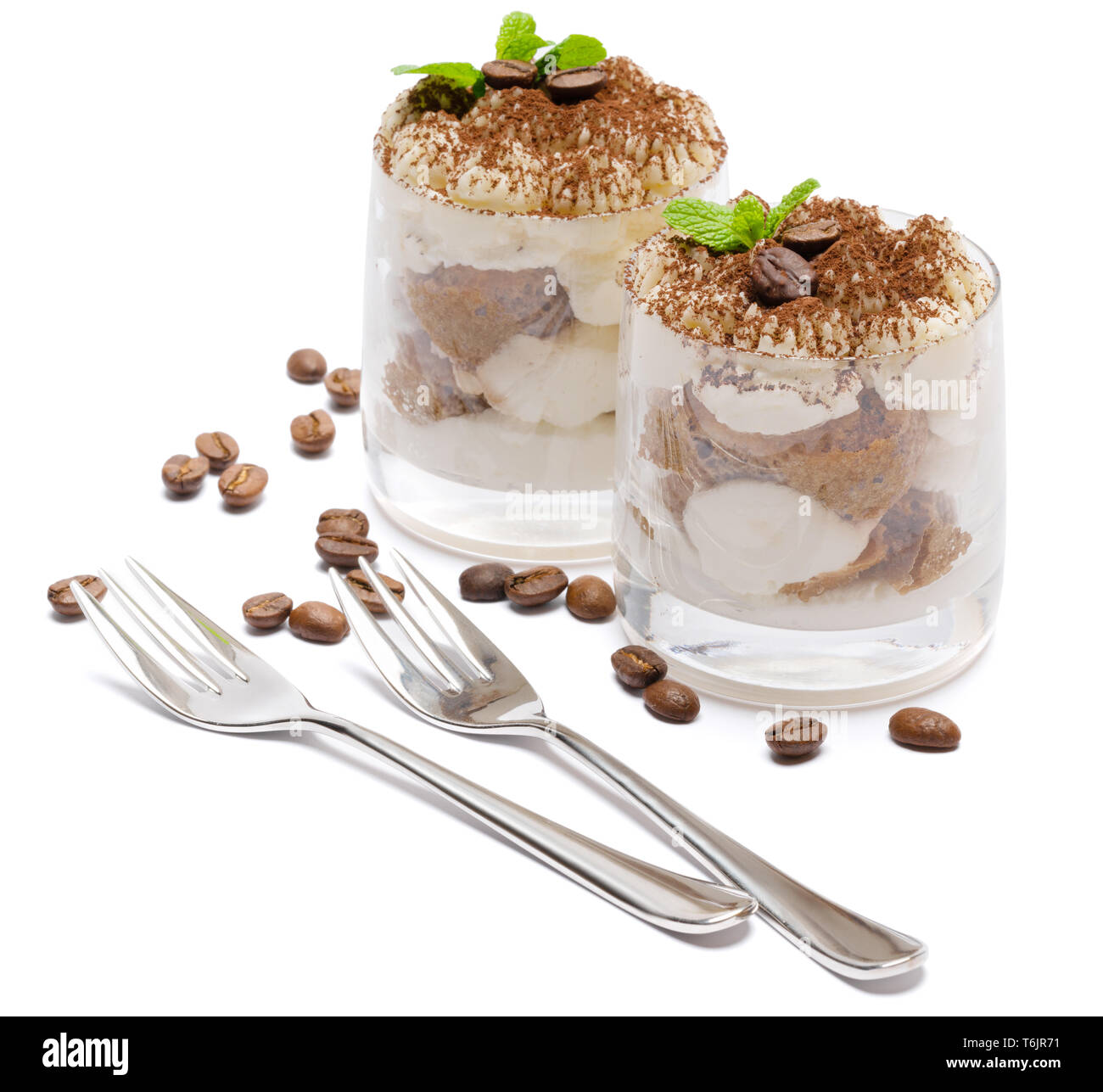 two portions Classic tiramisu dessert in a glass isolated on a white ...