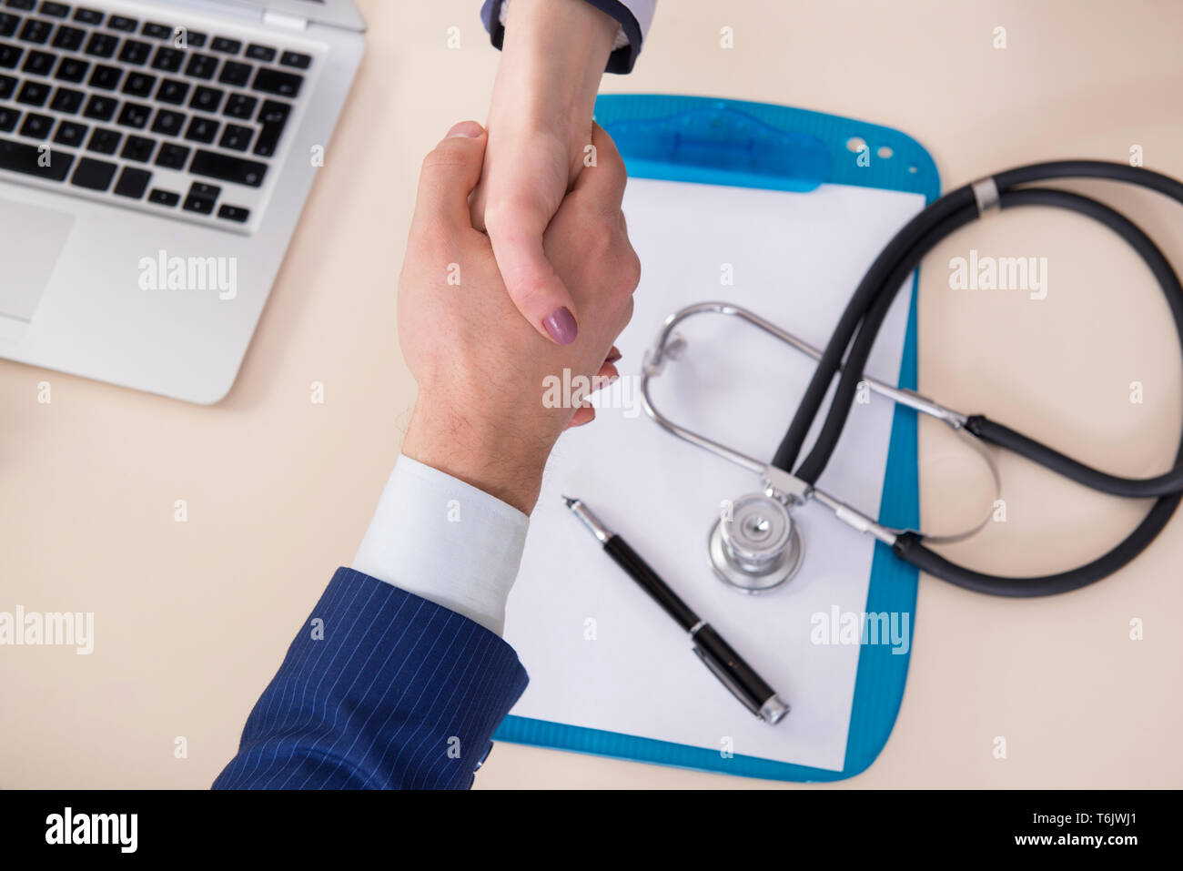 The man signing medical insurance contract Stock Photo - Alamy