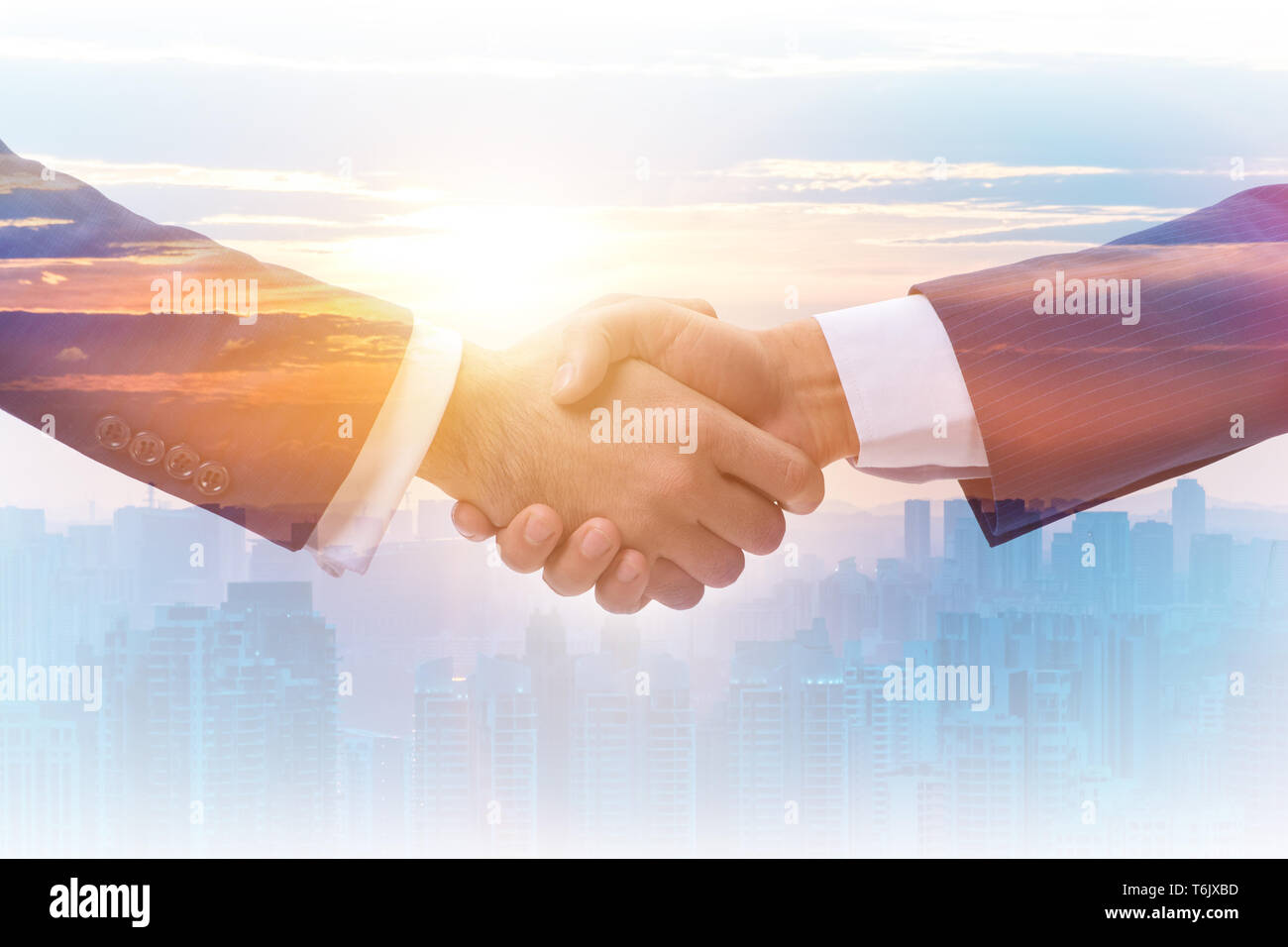 The concept of cooperation with handshake Stock Photo - Alamy