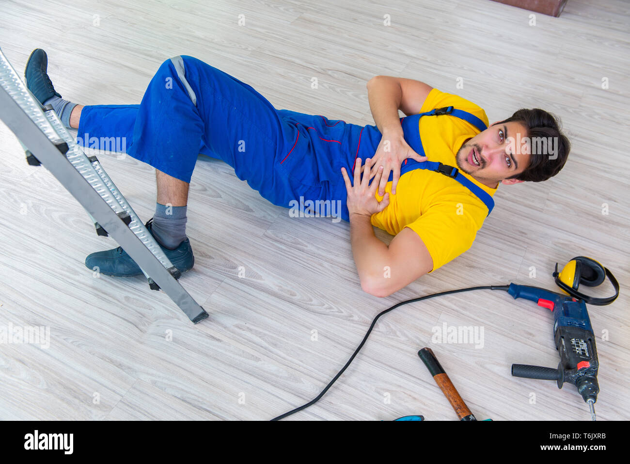 The injured worker at the work site Stock Photo - Alamy