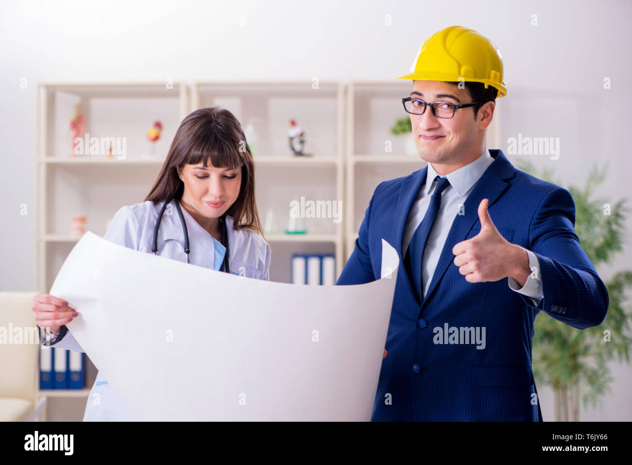 The doctor discussing new hospital plan with architect Stock Photo - Alamy