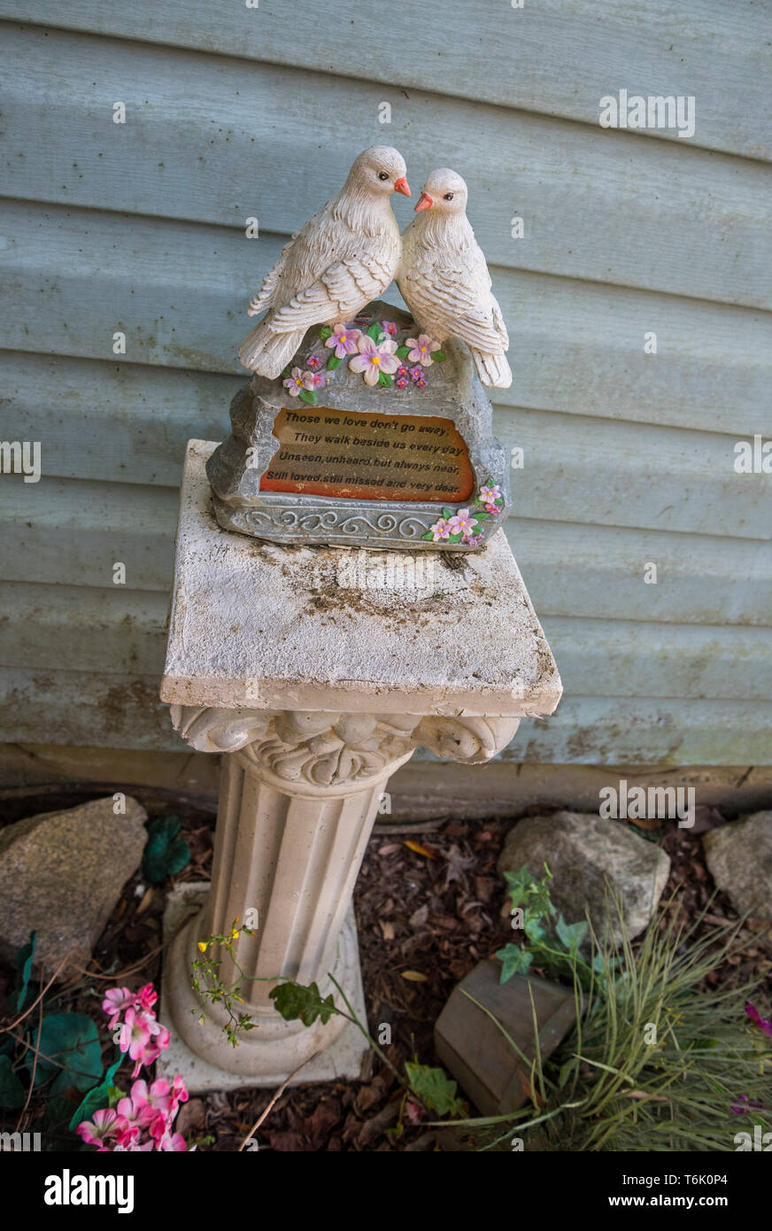 Honoring beloved family members in a memorial Garden set up in a yard ...