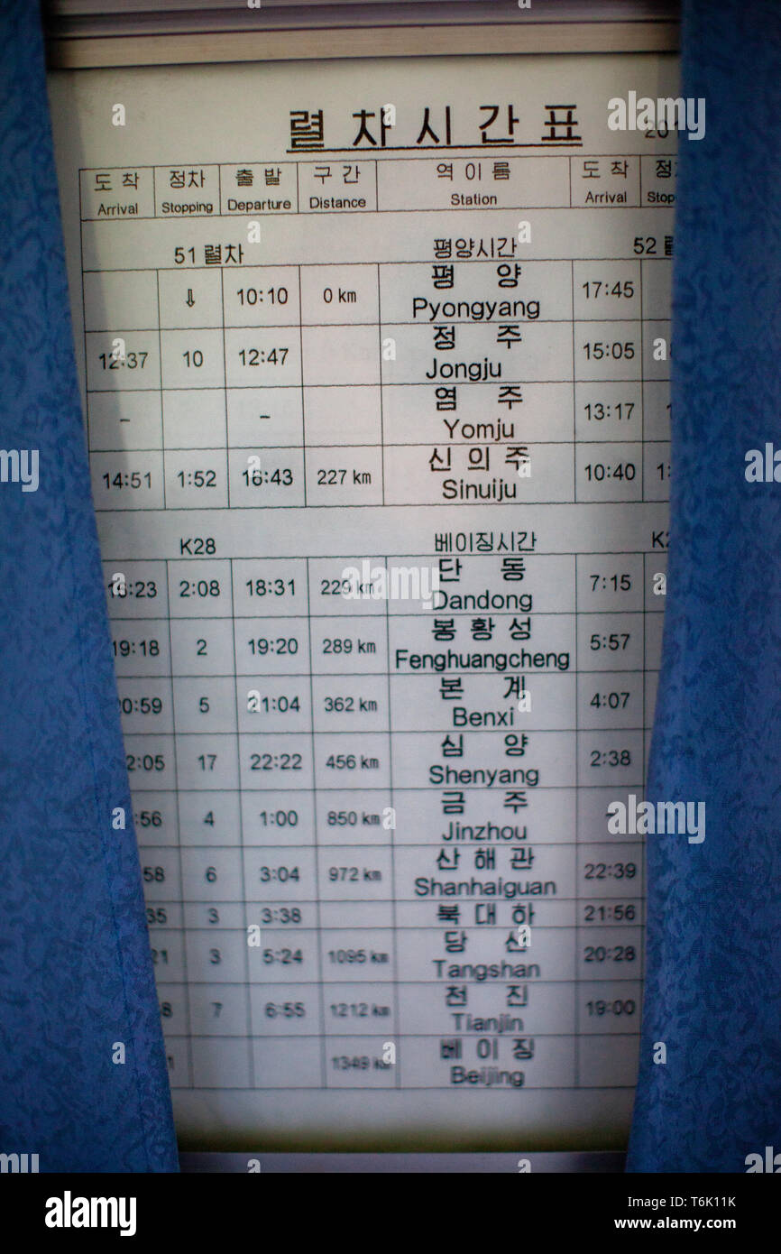 A timetable on the train between Dandong in China and Pyongyang in ...
