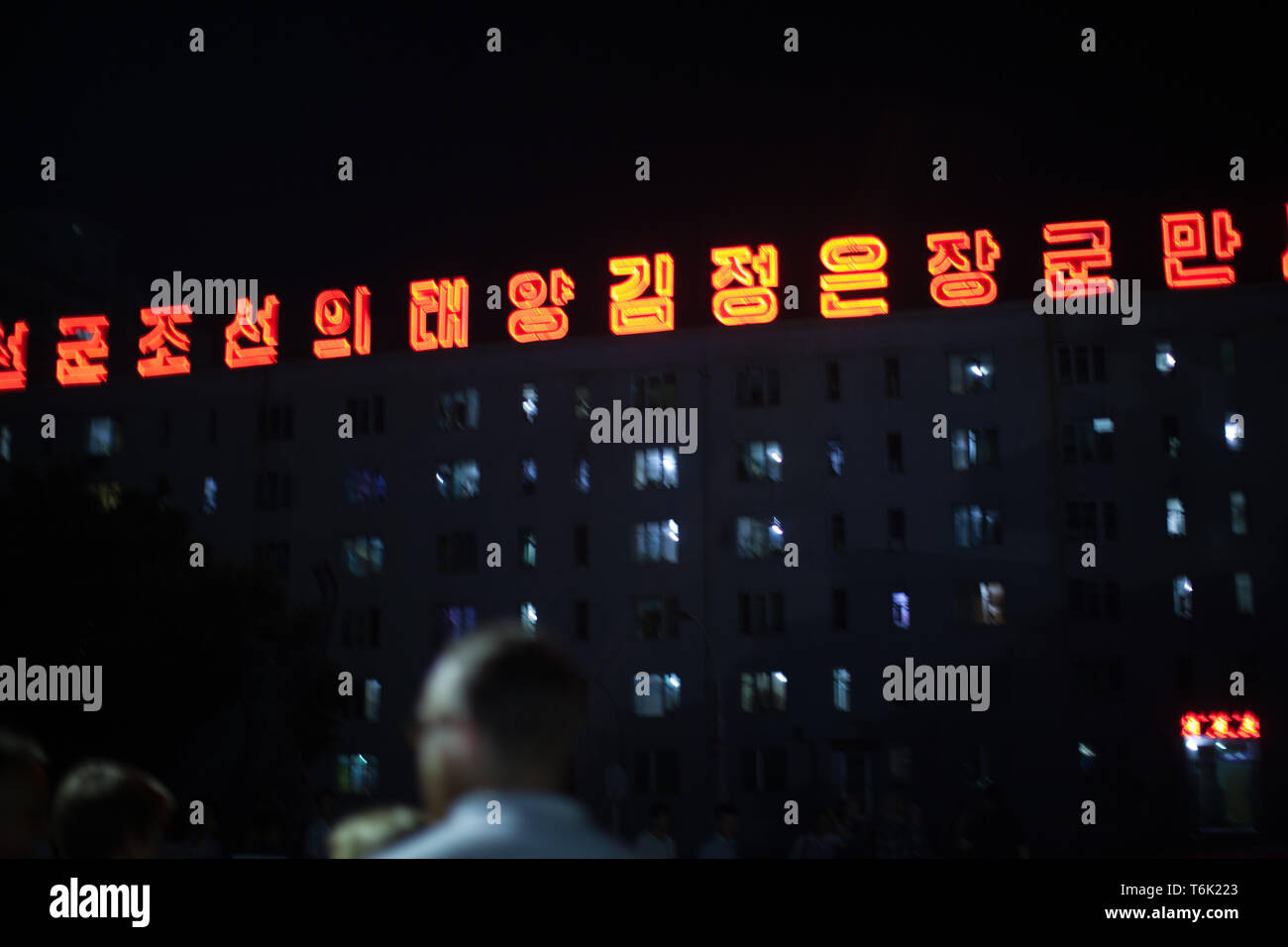 Orange neon signs illuminate a rooftop in Pyongyang, North Korea Stock ...