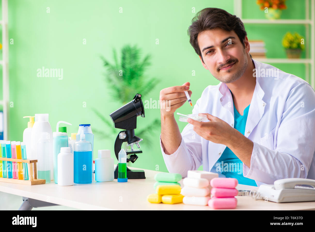 Chemist testing soap in hi-res stock photography and images - Alamy