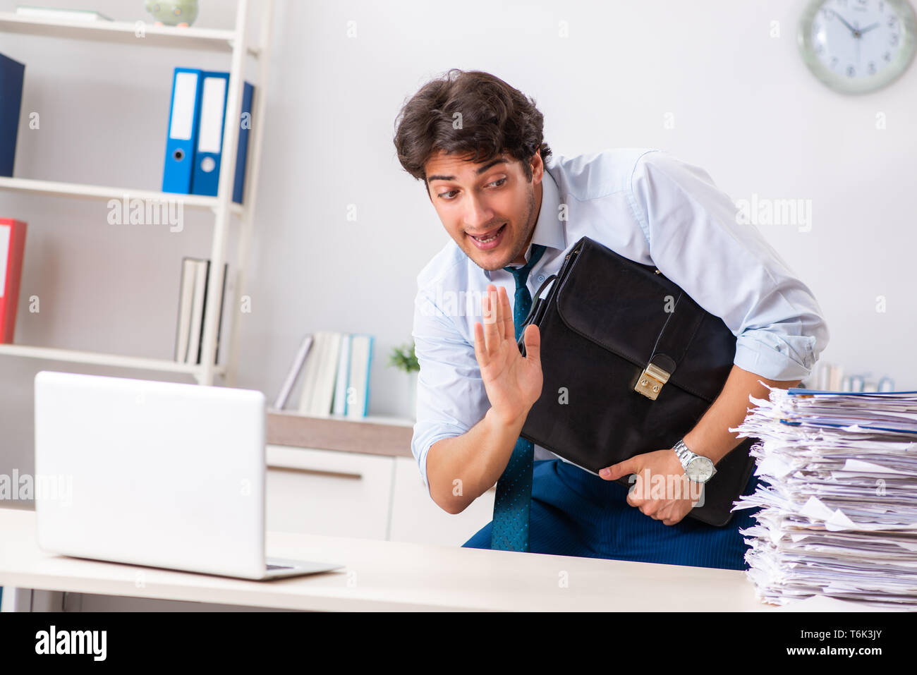 Overloaded busy employee with too much work and paperwork Stock Photo ...