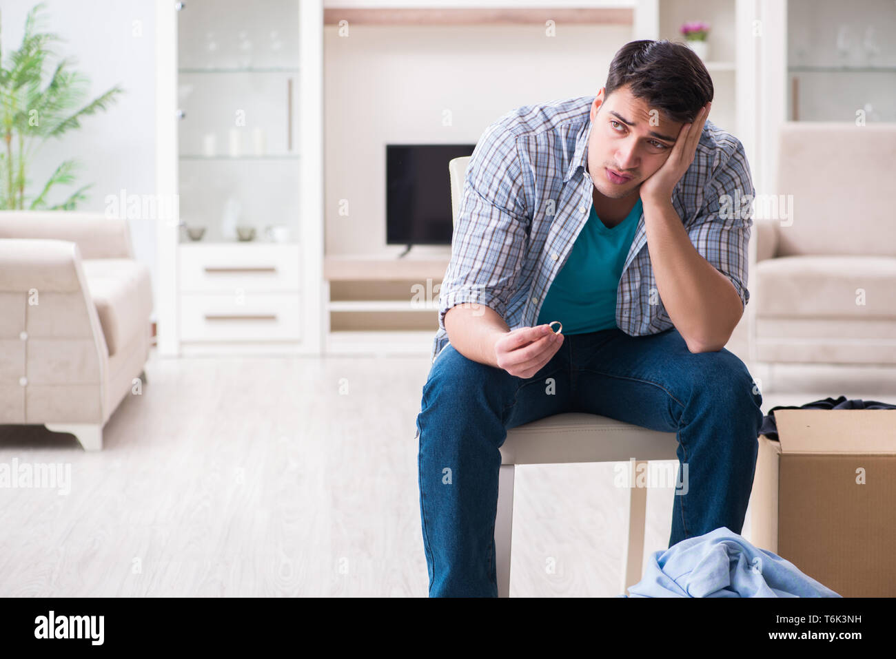 Woman evicting man from house during family conflict Stock Photo - Alamy