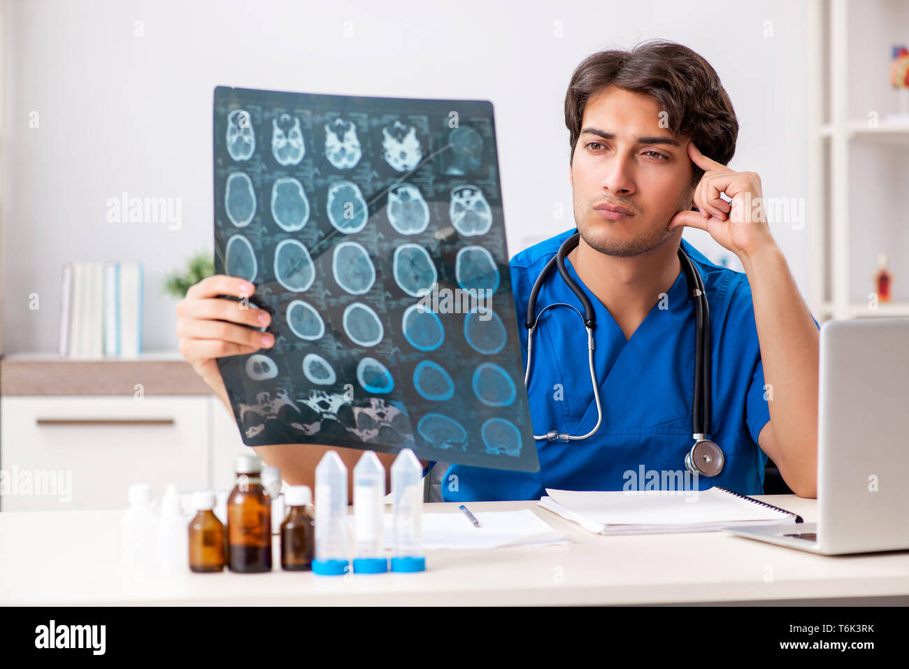 Male doctor radiologist with x-ray can image Stock Photo - Alamy