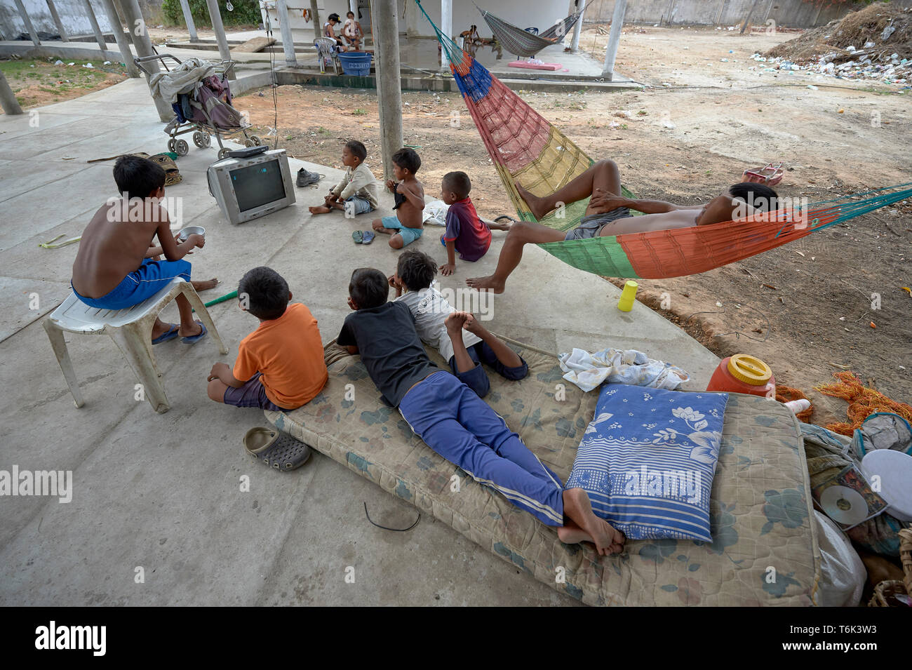 Warao indigenous refugees from Venezuela watch television in their ...