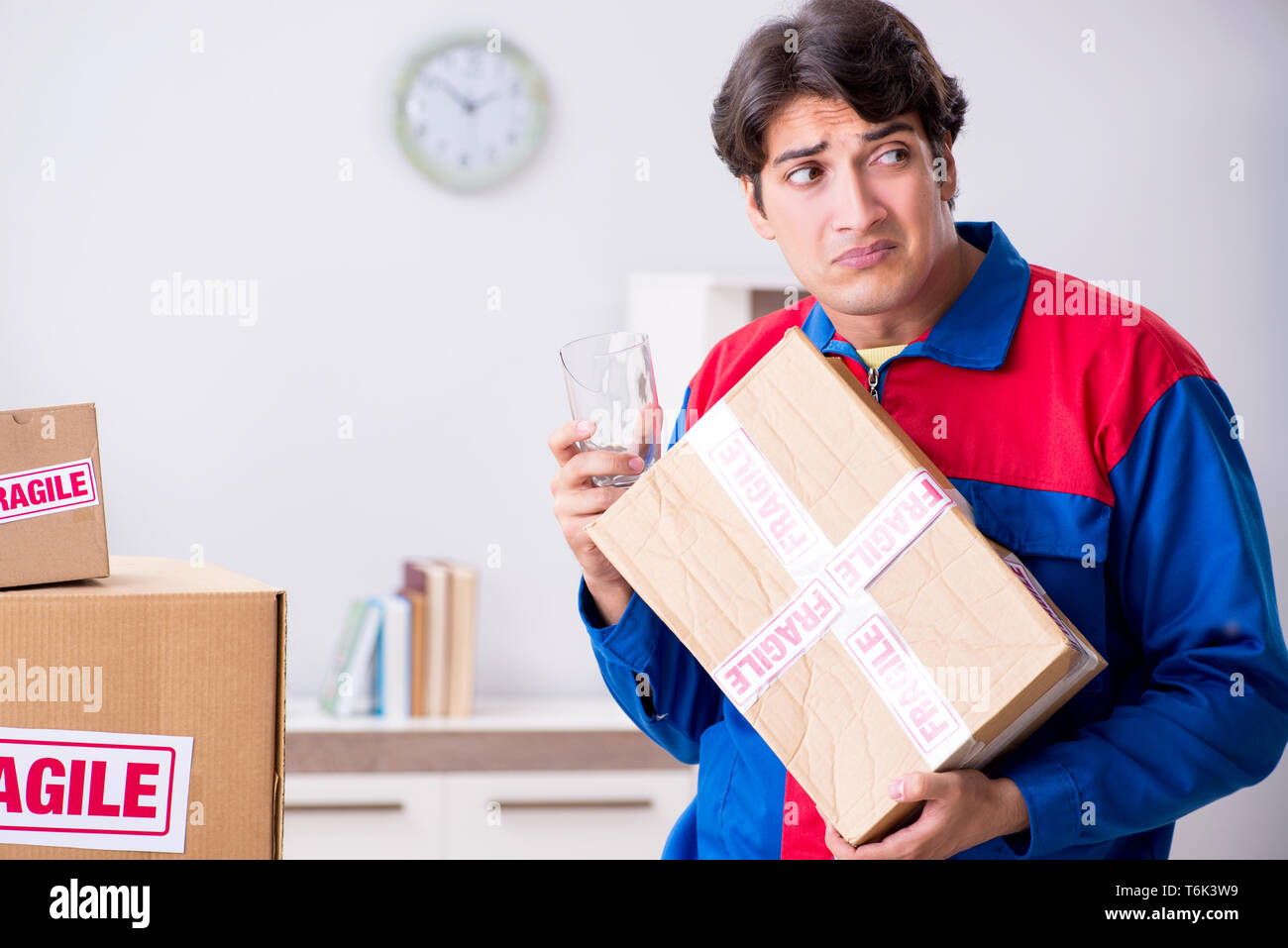 Transportation contractor with fragile boxes Stock Photo - Alamy