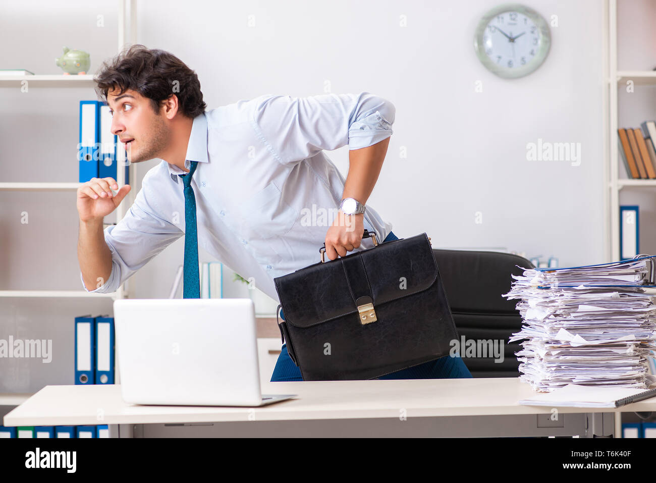 Overloaded busy employee with too much work and paperwork Stock Photo ...