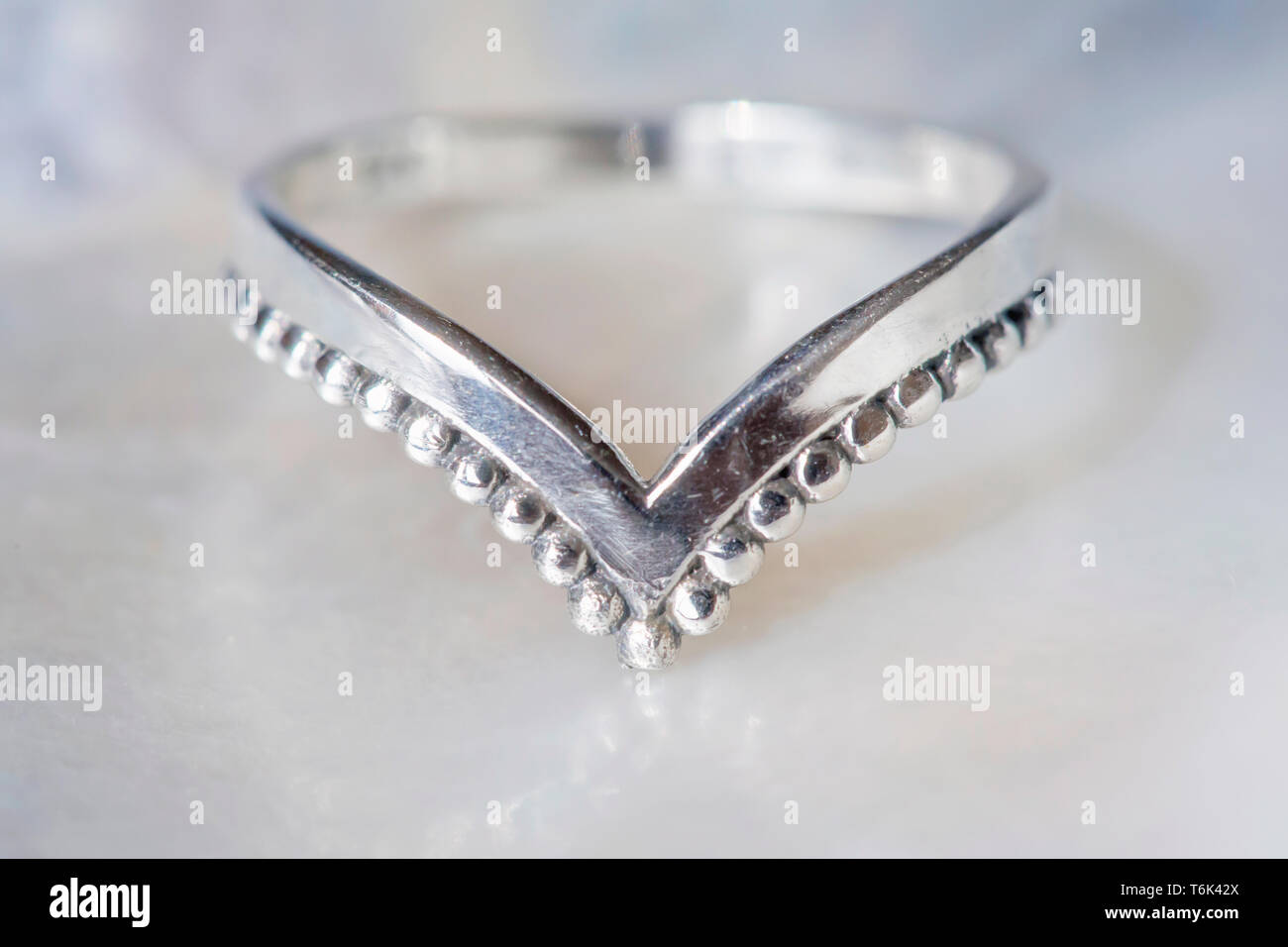 Silver female elegant decorative ring Stock Photo - Alamy
