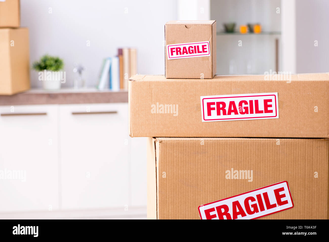 Transportation contractor with fragile boxes Stock Photo - Alamy