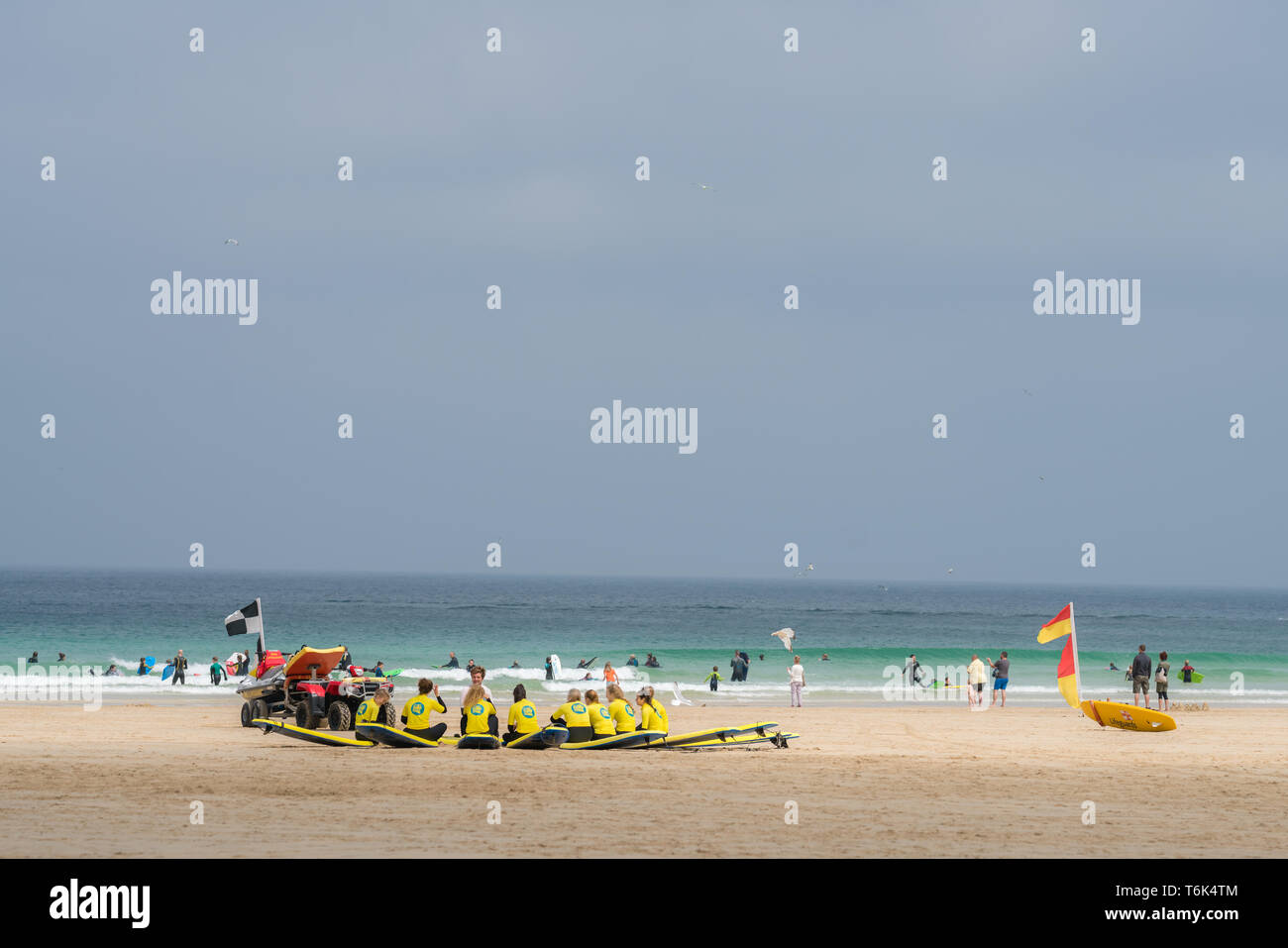 Surfers Sitting On The Beach High Resolution Stock Photography and ...