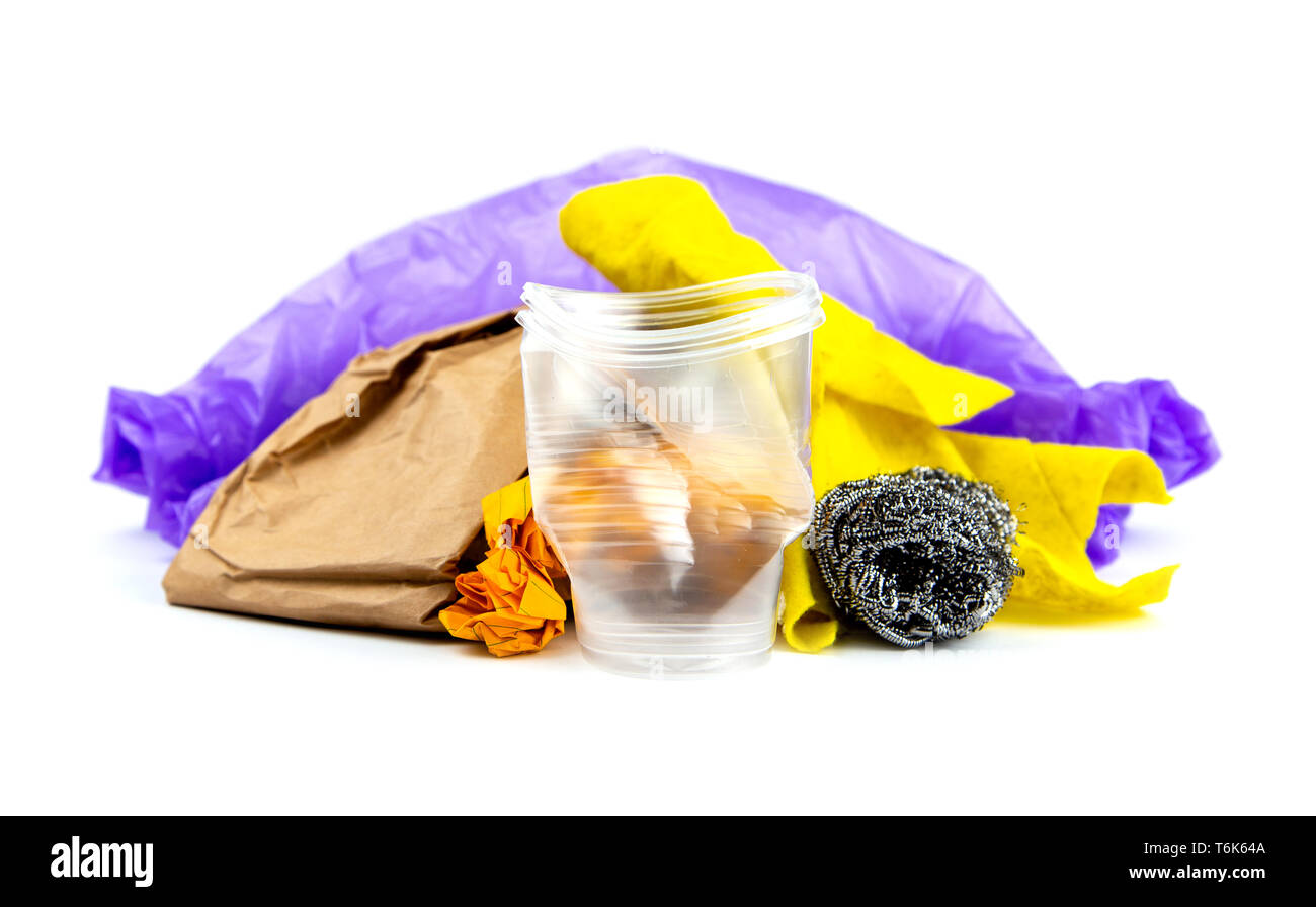 Concept of garbage and pollution. A pile of trash, crumpled plastic cup ...