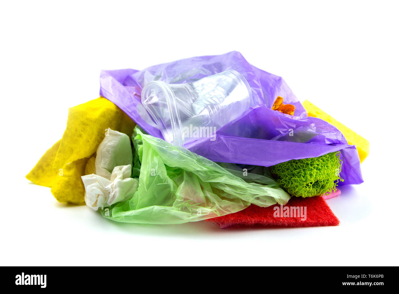 Concept of garbage and pollution. A pile of trash, crumpled plastic cup ...