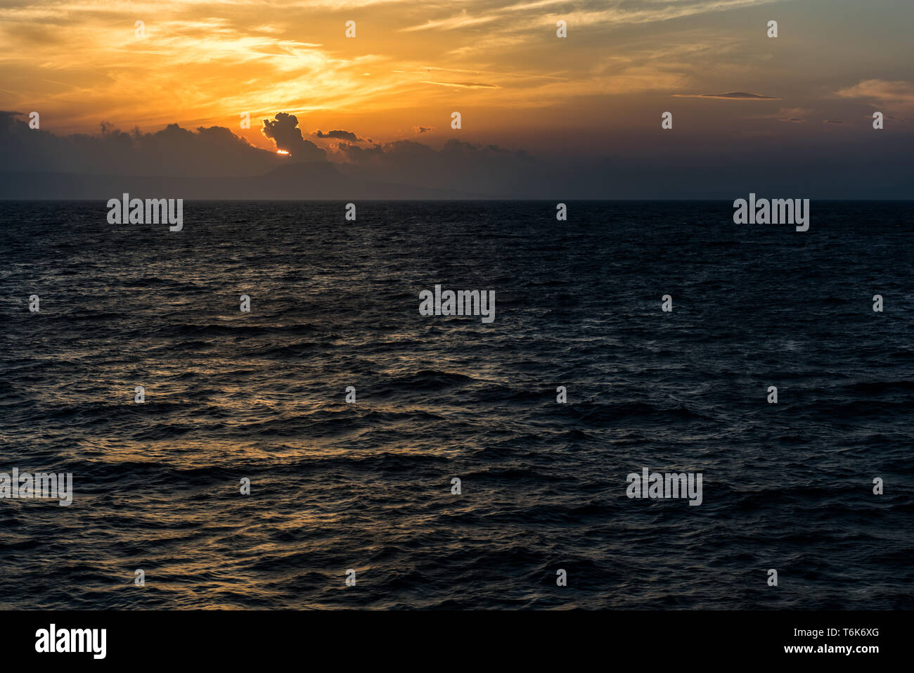 Orange sunset above sea hi-res stock photography and images - Alamy