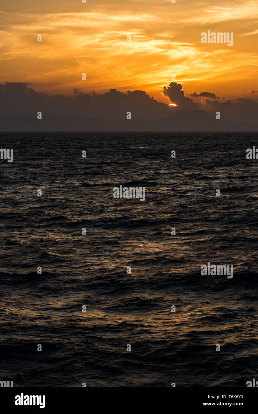 Orange sunset above sea from ship Stock Photo - Alamy