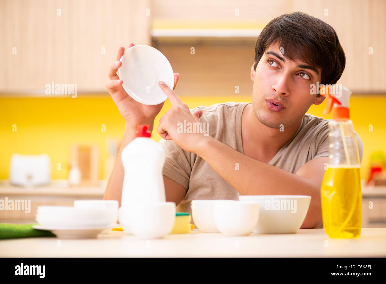 The man washing dishes at home Stock Photo - Alamy