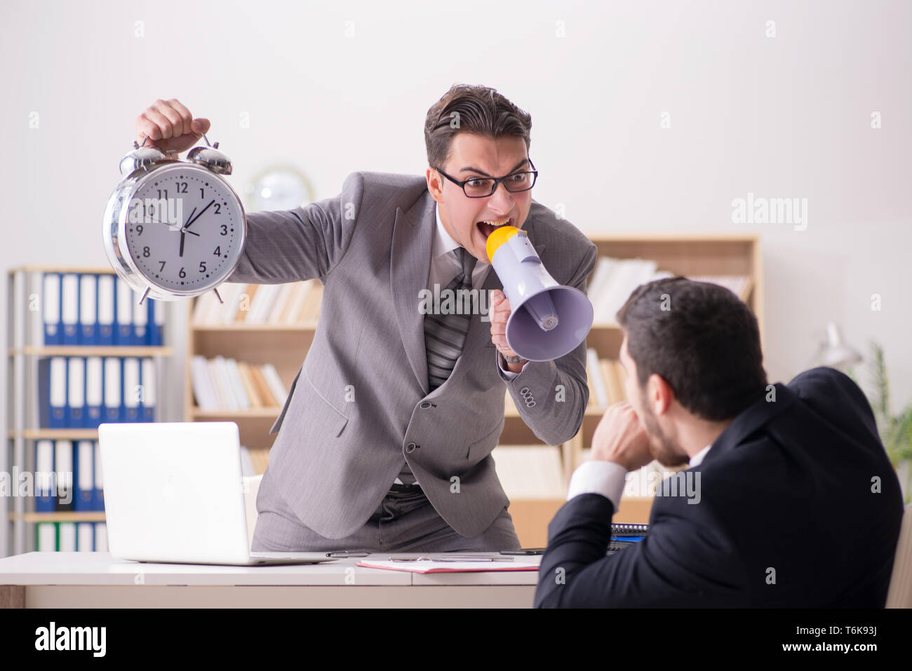 The angry boss shouting at his employee Stock Photo - Alamy