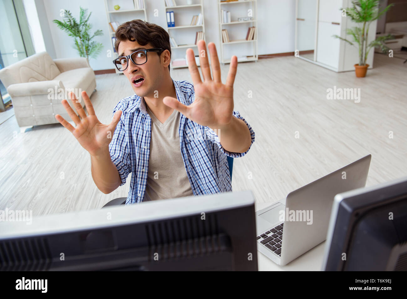 The young trader monitoring markets on screens Stock Photo - Alamy