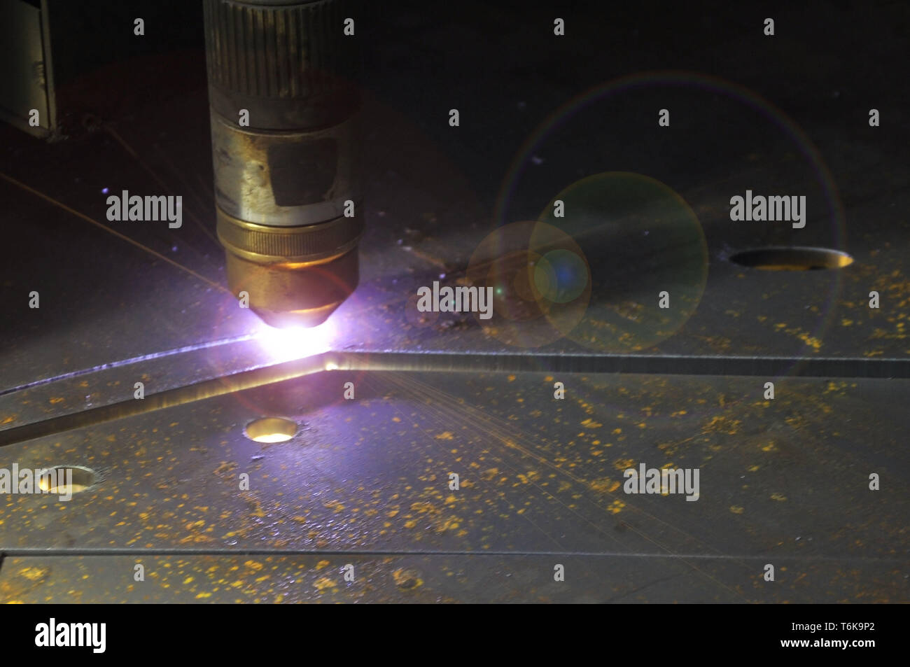 laser cutting torch machine in an industrial plant cuts sheet metal ...