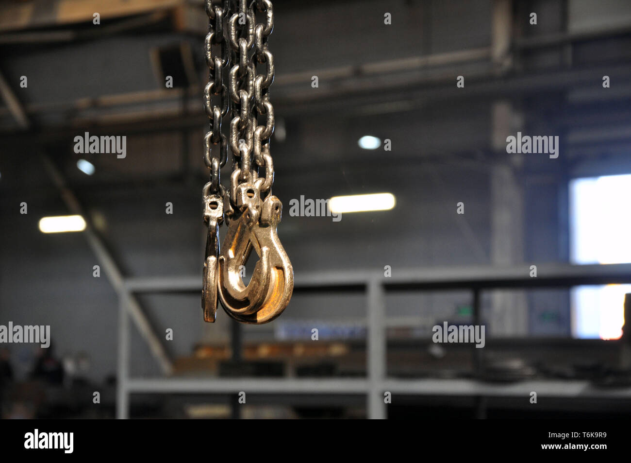 Metallic industrial hook for lifting heavy thing in the factory ...