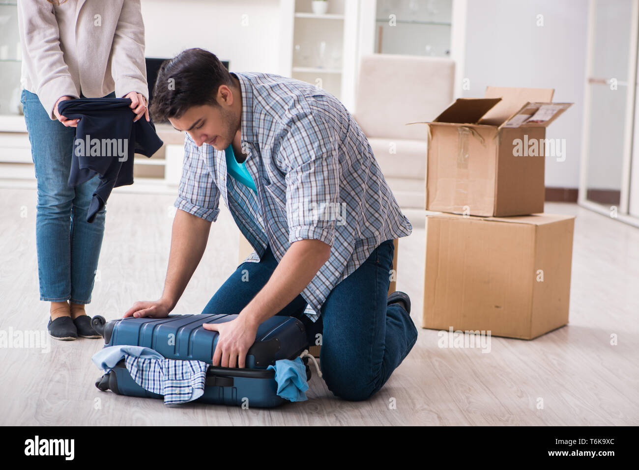 The woman evicting man from house during family conflict Stock Photo ...