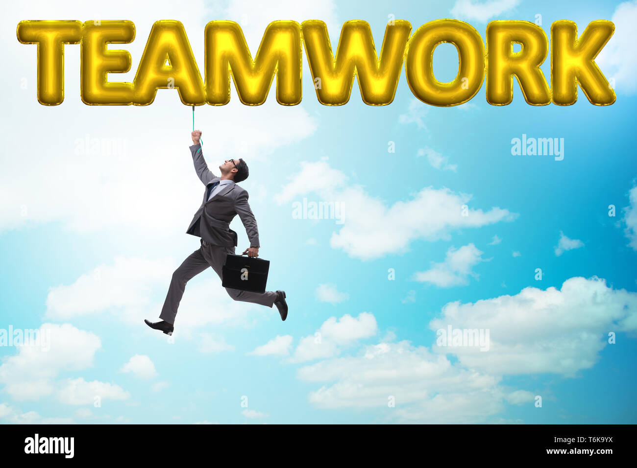 The businessman flying in teamwork concept Stock Photo - Alamy
