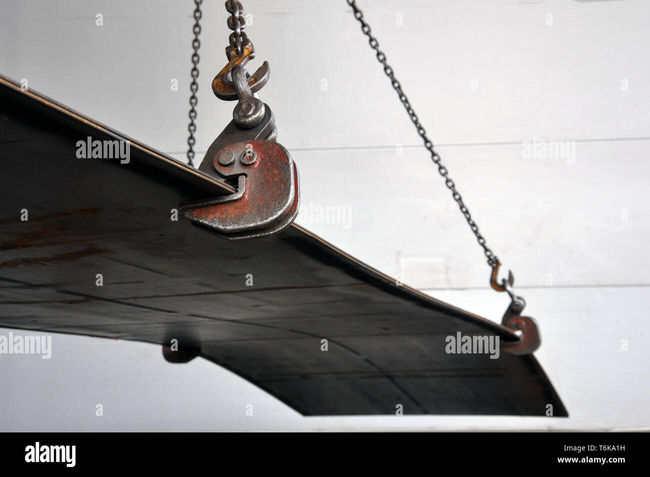 Lifting chains and hooks for loading sheet metal. Grab. Industry Stock ...