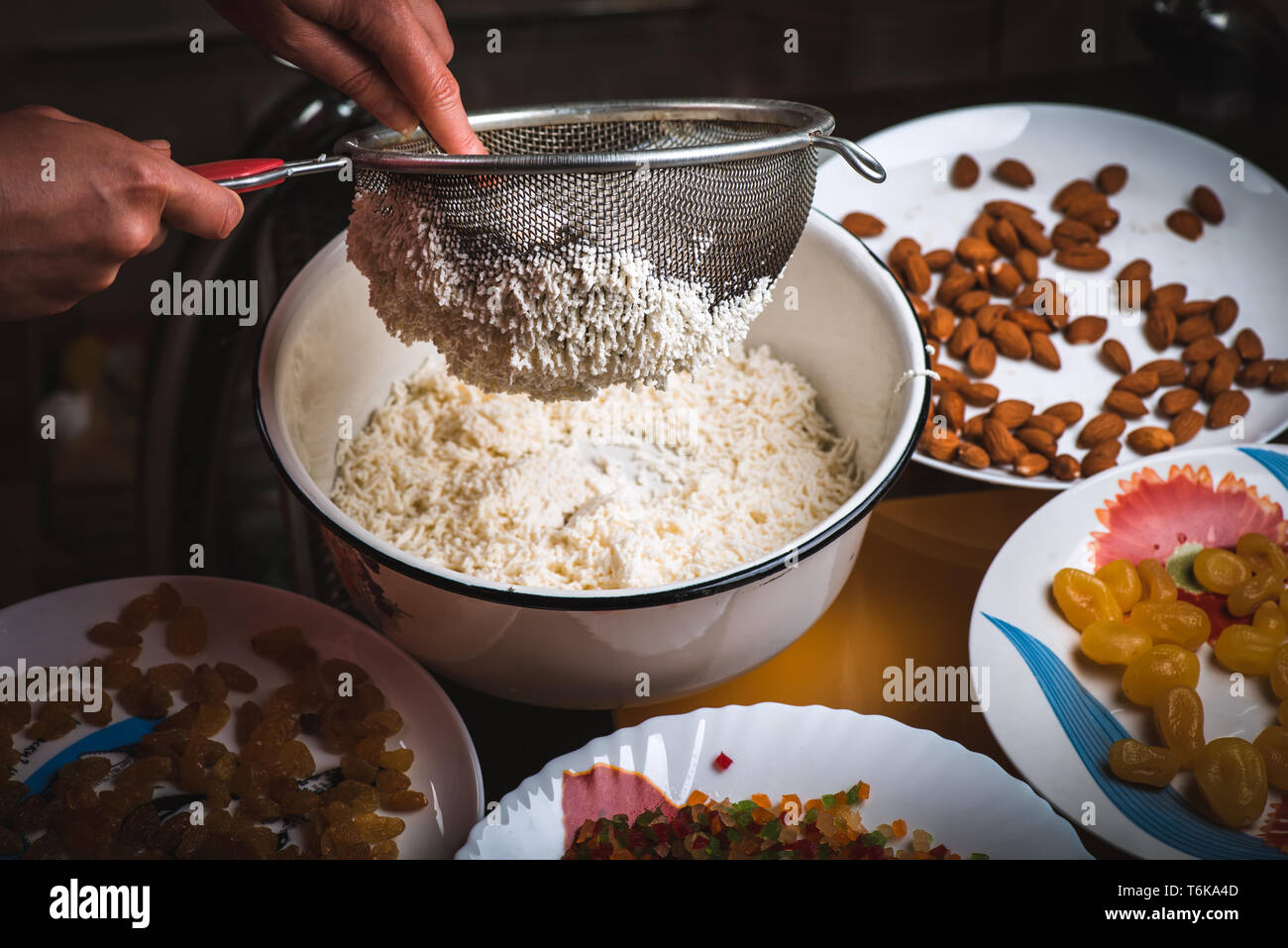 The process of making traditional Easter molded cottage cheese dessert ...