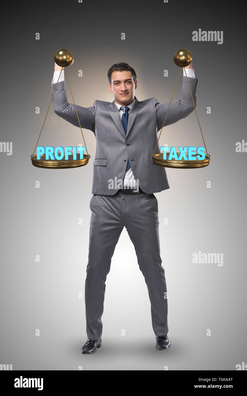 The businessman comparing profit and taxes Stock Photo - Alamy