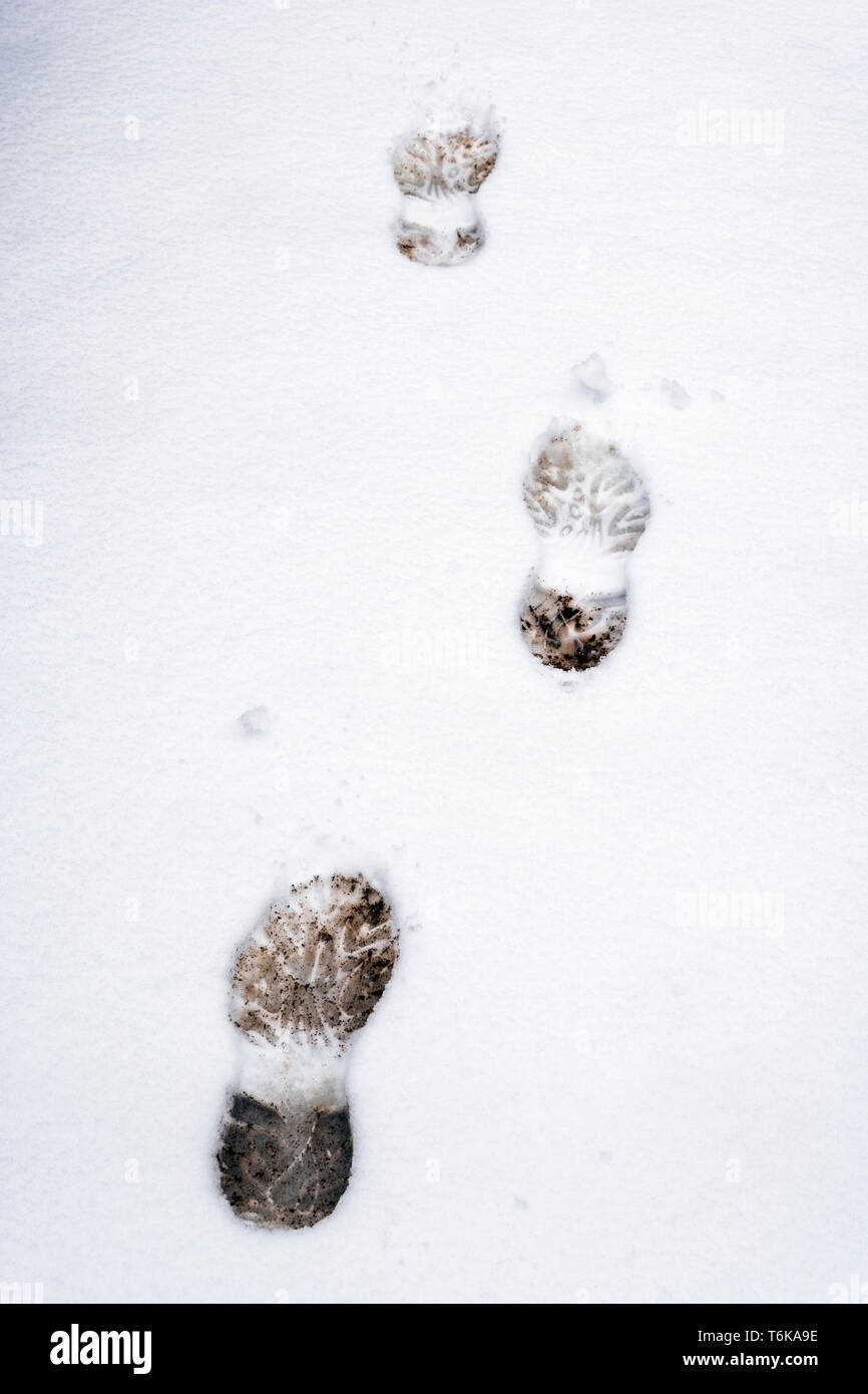 Boot footprints in fresh snow Stock Photo - Alamy