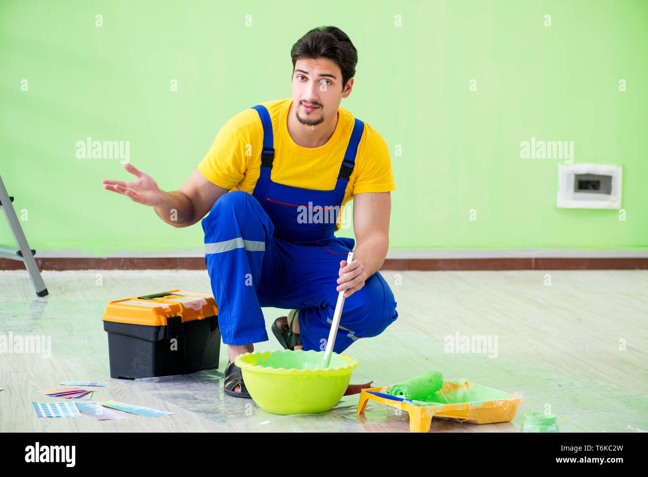 Young man doing home renovation Stock Photo - Alamy