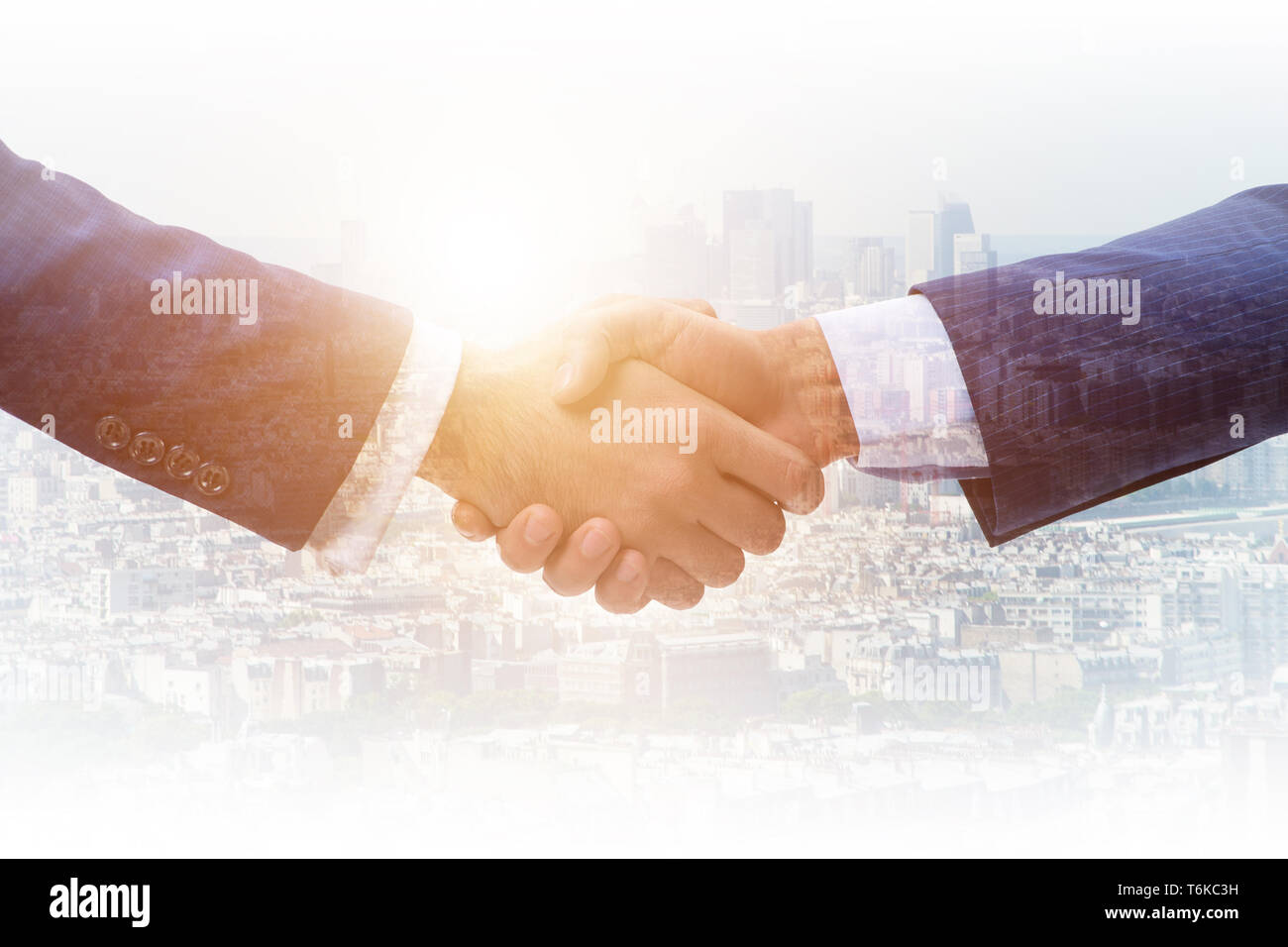Concept of cooperation with handshake Stock Photo - Alamy