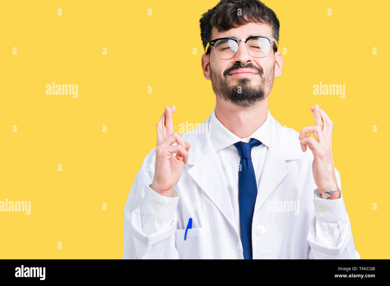 Young professional scientist man wearing white coat over isolated ...