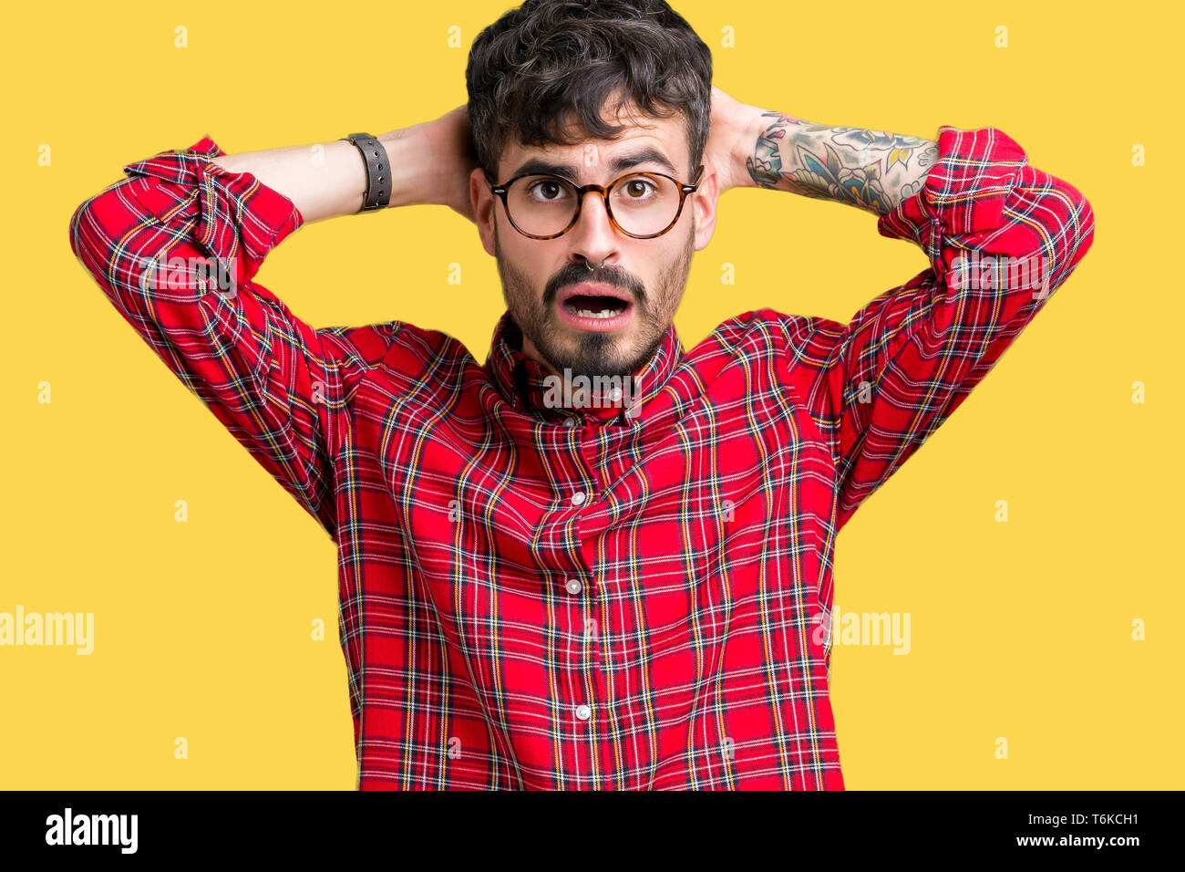 Young handsome man wearing glasses over isolated background Crazy and ...