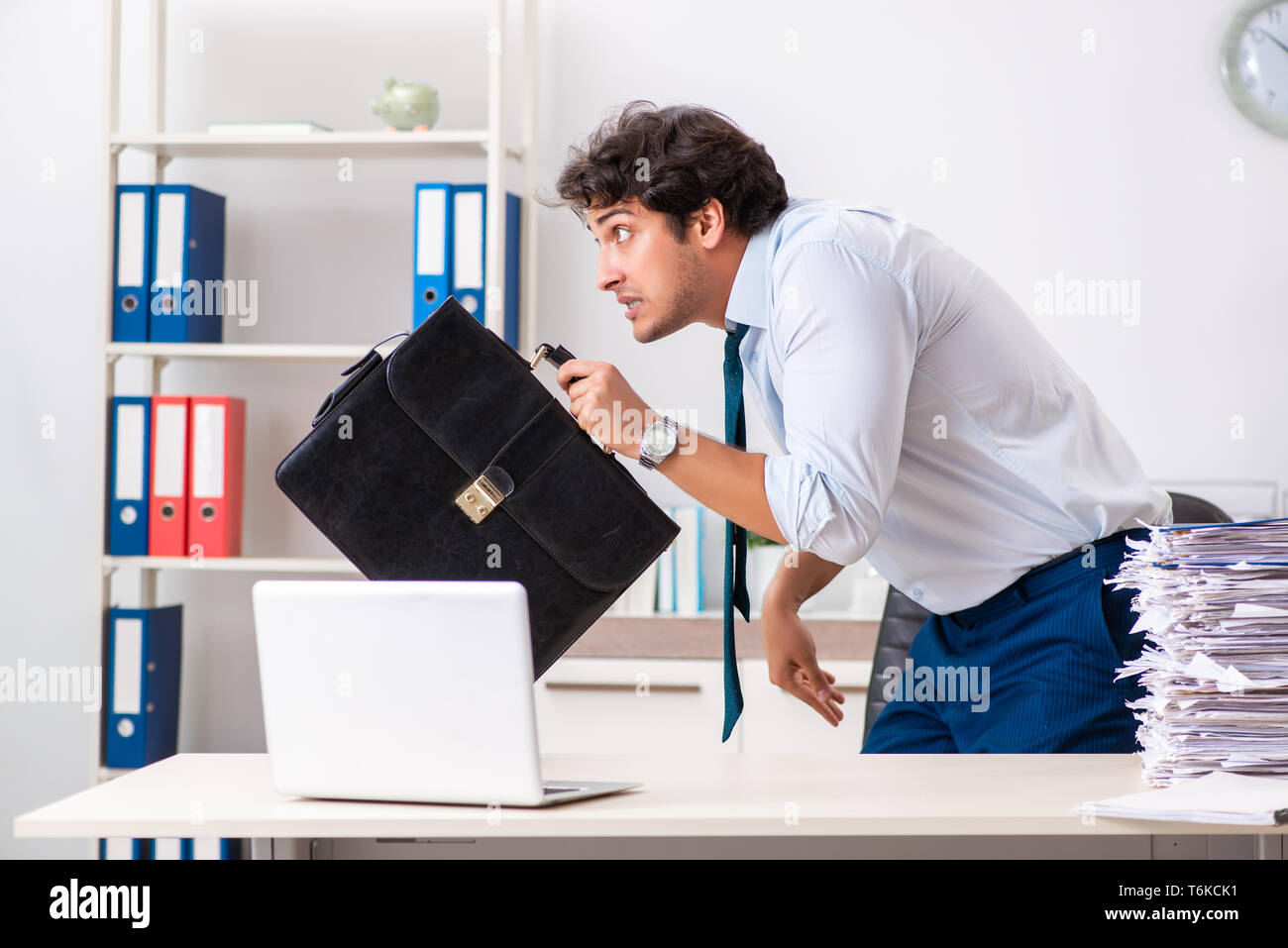 Overloaded busy employee with too much work and paperwork Stock Photo ...