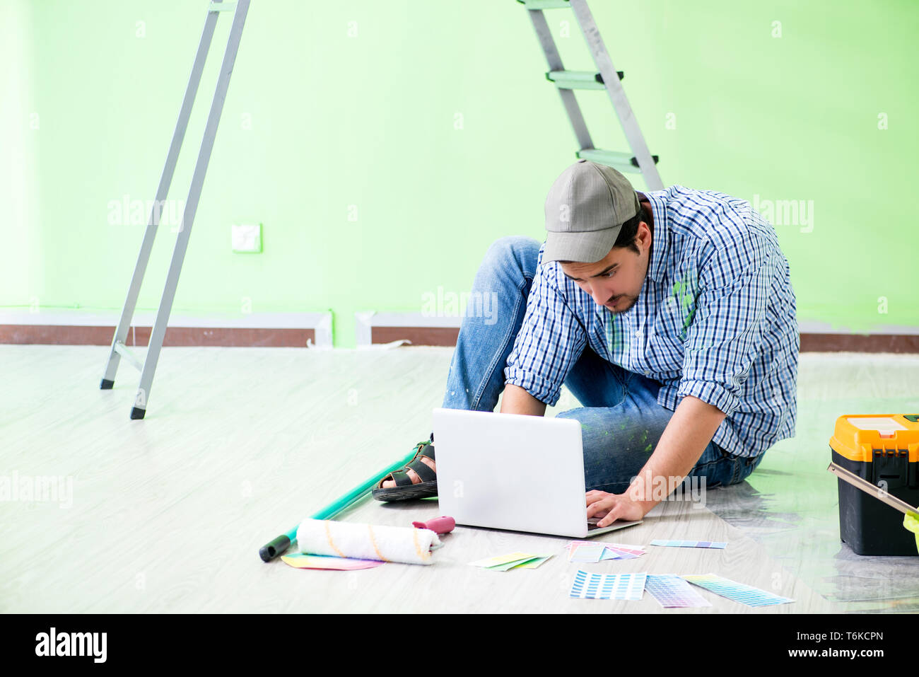 Young man doing home renovation Stock Photo - Alamy
