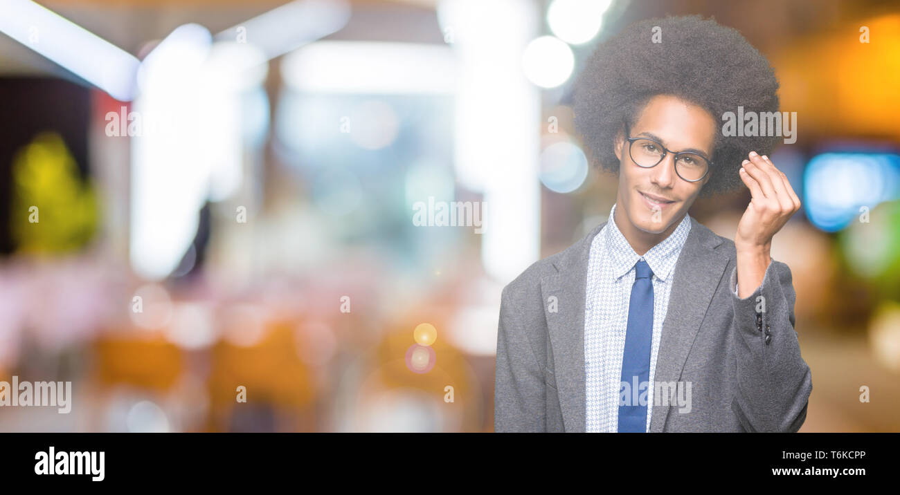 Young african american business man with afro hair wearing glasses ...