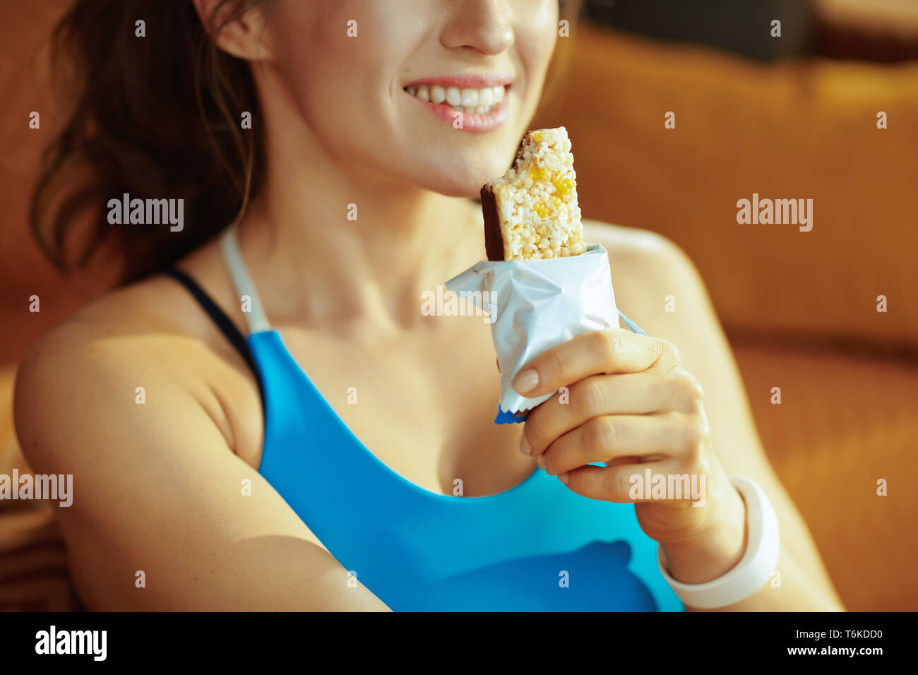 Woman eating chocolate protein bar hi-res stock photography and images ...